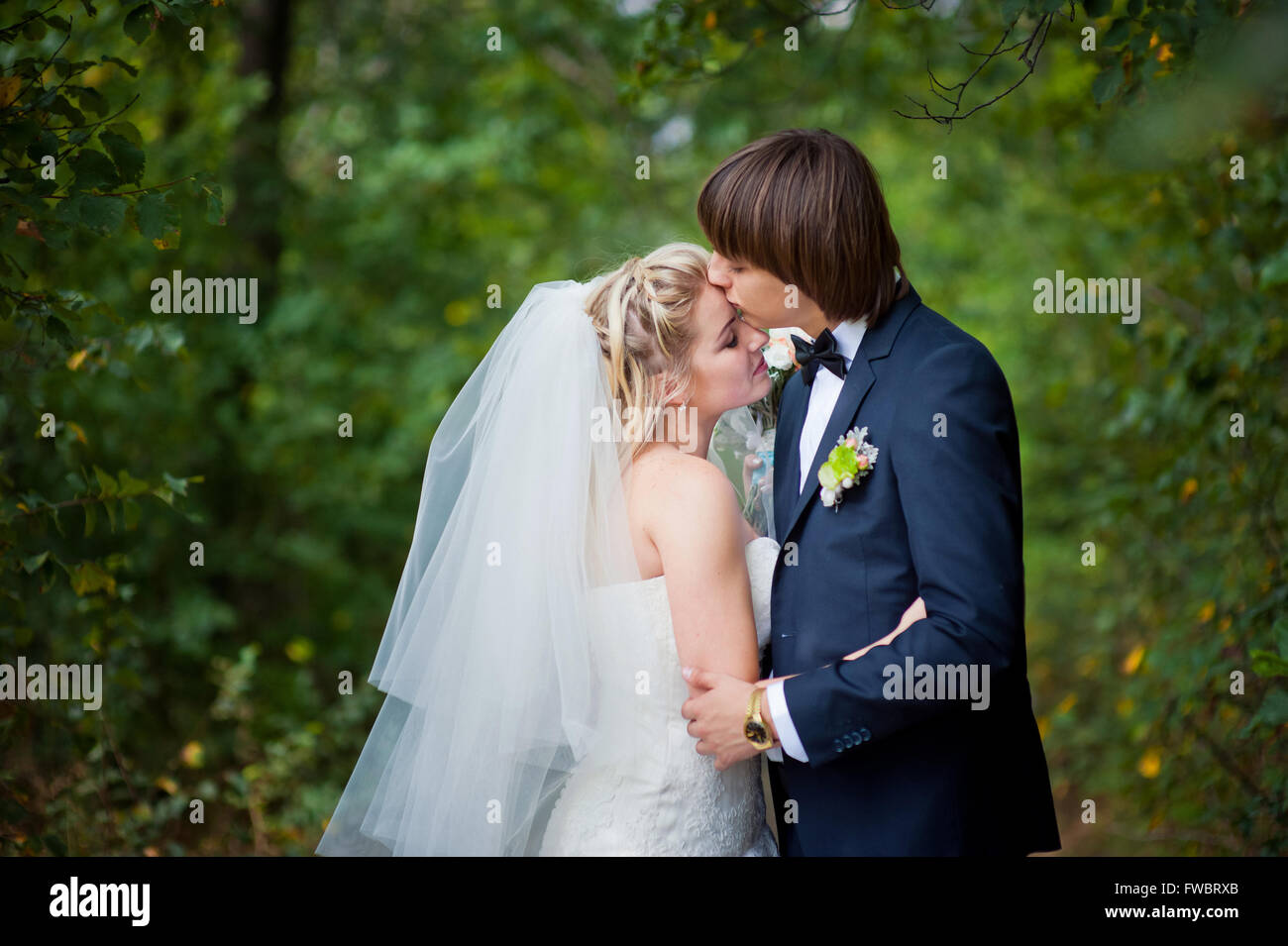 Beauty bride and groom on wedding walk in park Stock Photo - Alamy