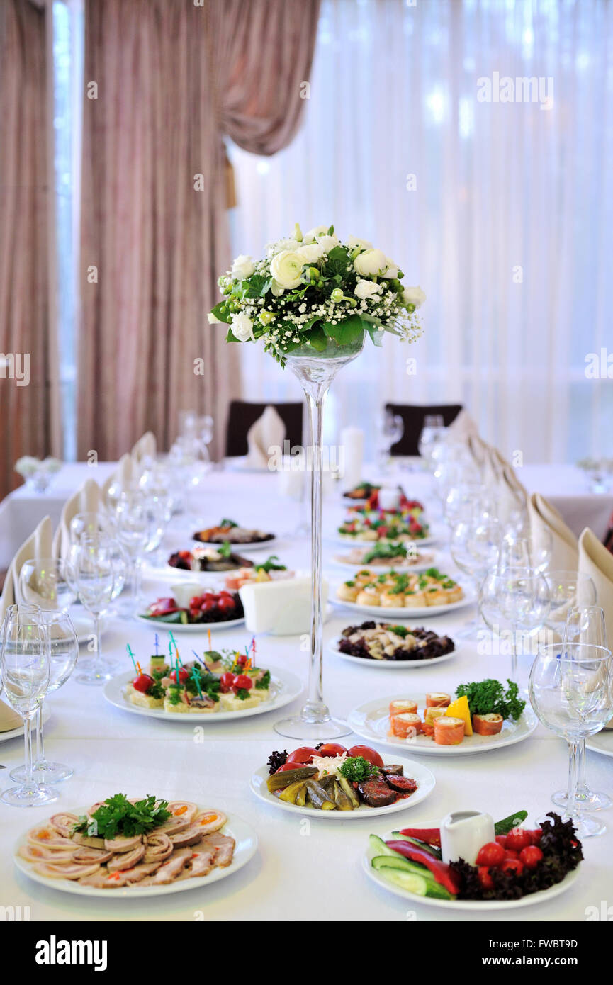 Wedding table at a wedding feast decorated with bridal bouquet Stock ...