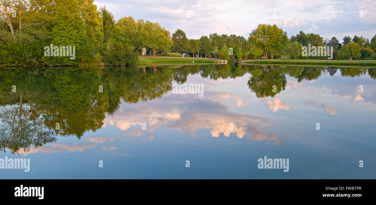 Park and lake at Fearrington Village, North Carolina with cloud ...