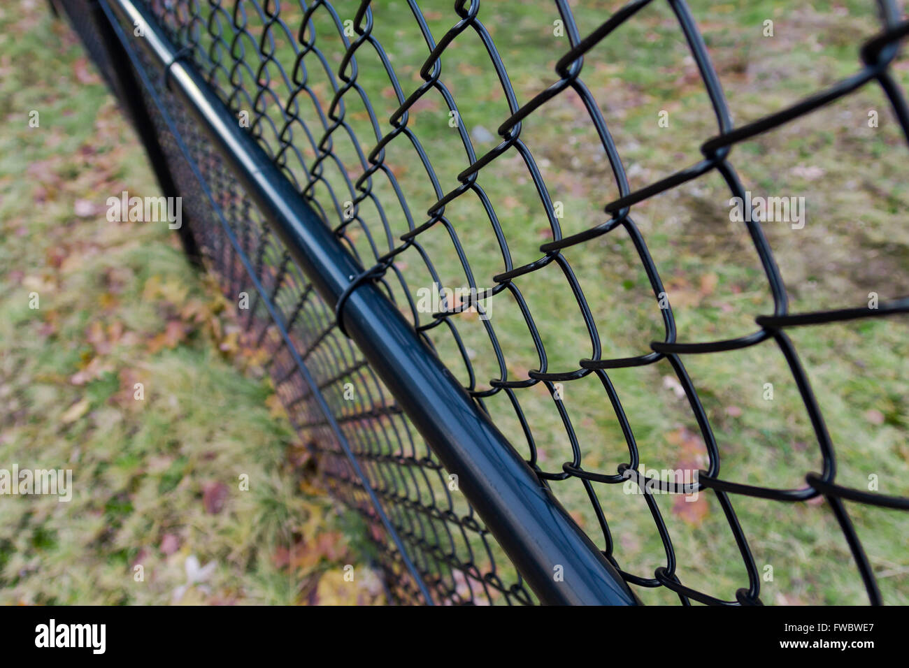 Fence pointing down Stock Photo - Alamy