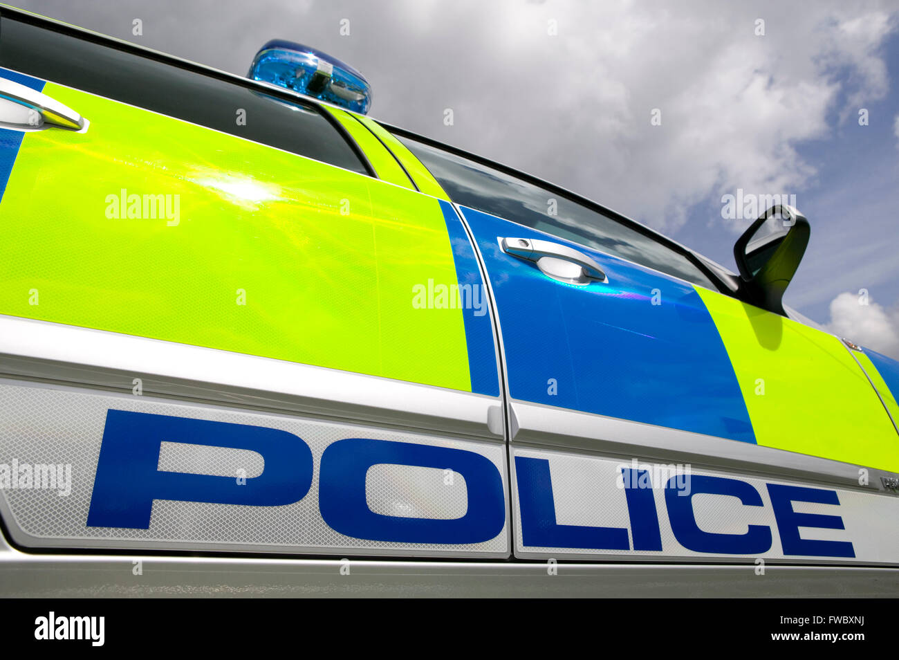 The side of a police car showing the large lettering and the relfective ...