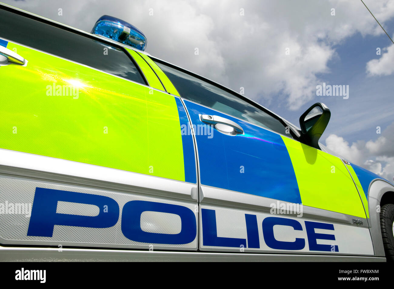 The side of a police car showing the large lettering and the relfective ...