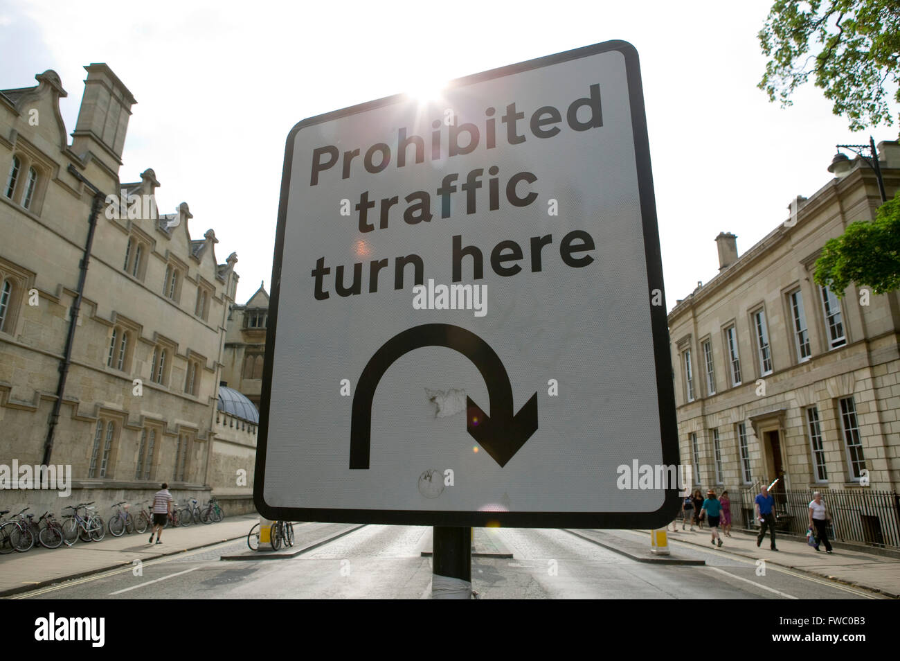 A prohibited traffic sign telling car users to turn back and directing ...