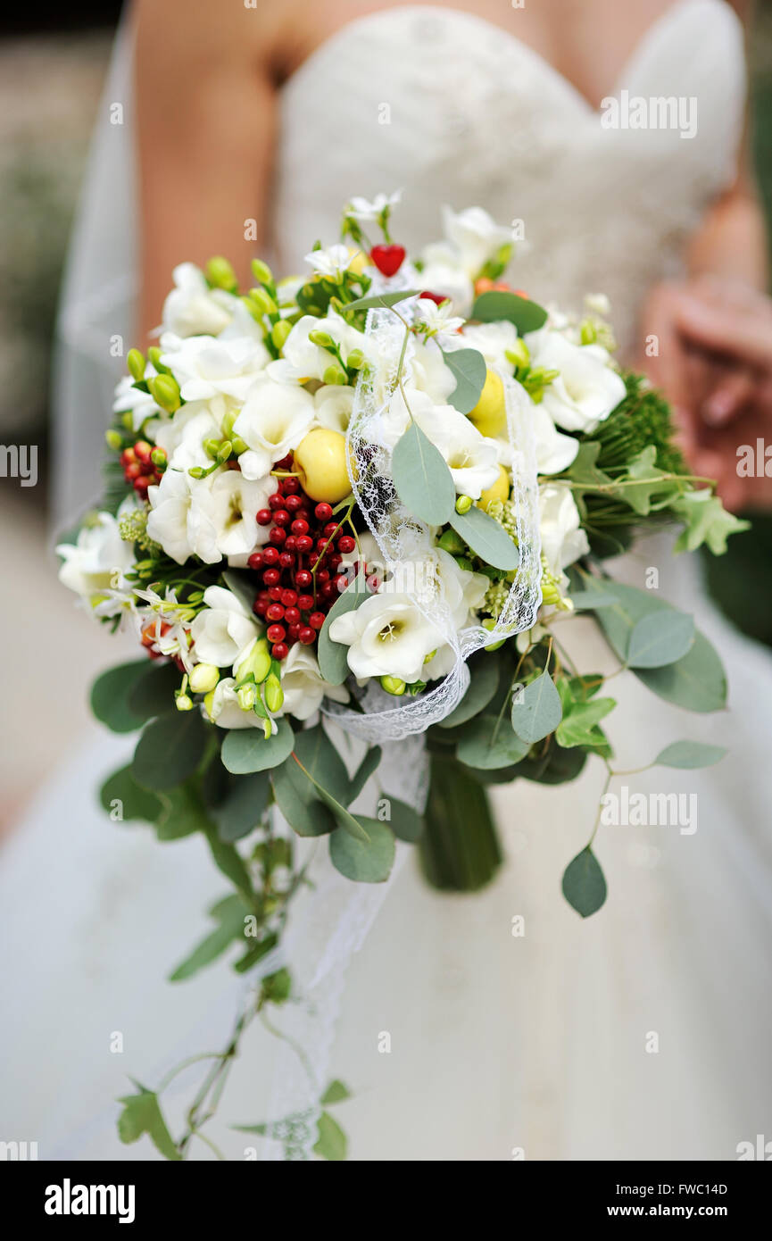 bride holding wedding bouquet with white flowers Stock Photo - Alamy