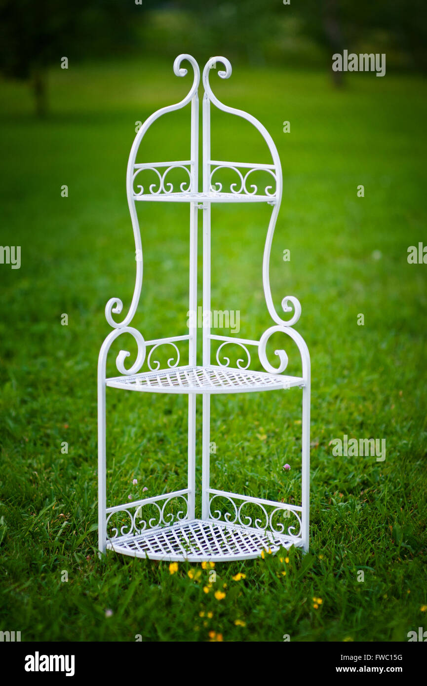 Decorative white stand on green grass Stock Photo - Alamy