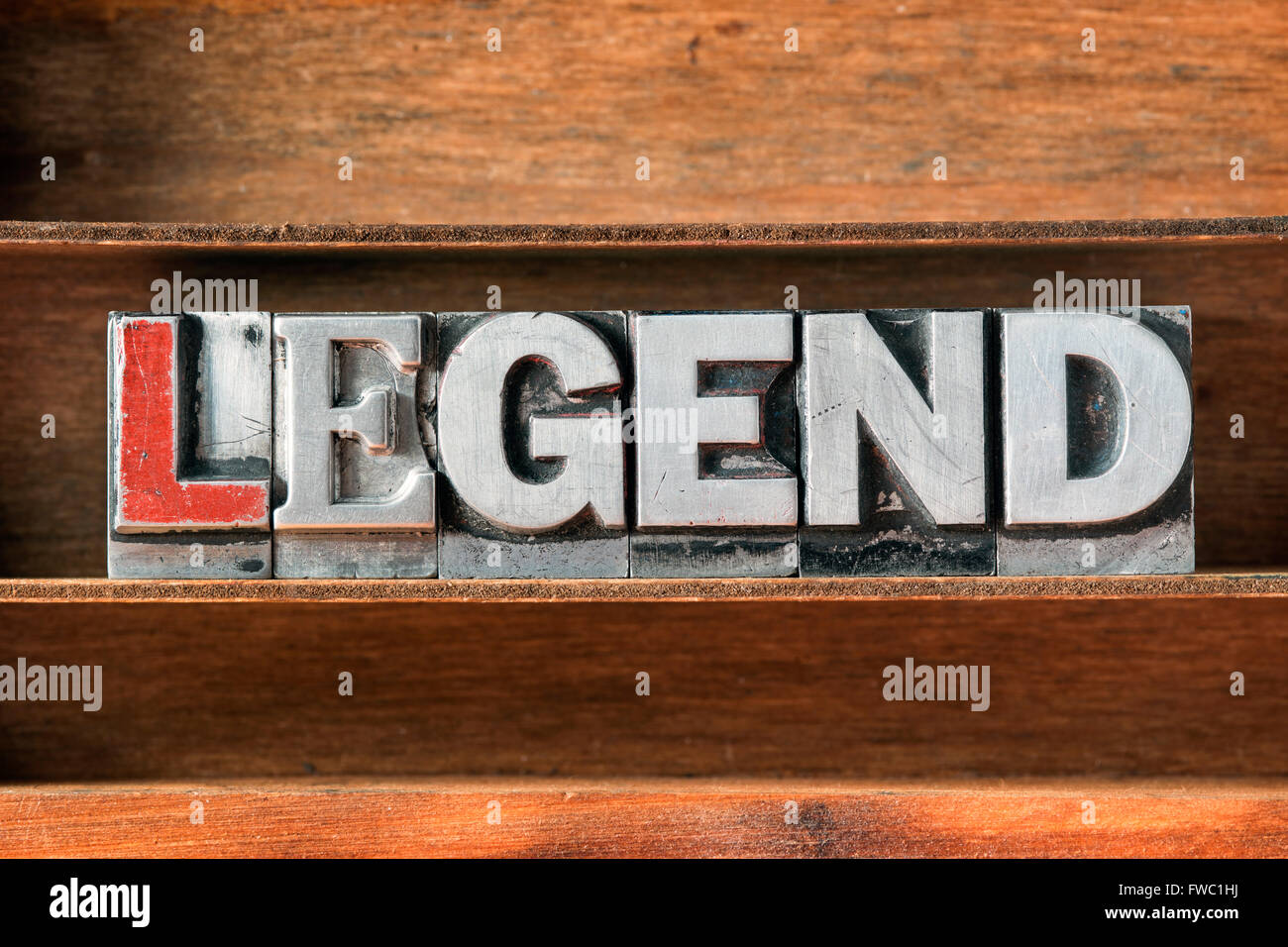 legend word made from metallic letterpress type on wooden tray Stock ...