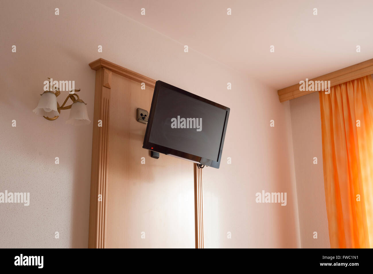 light room interior with TV panel hanged on the wall Stock Photo - Alamy