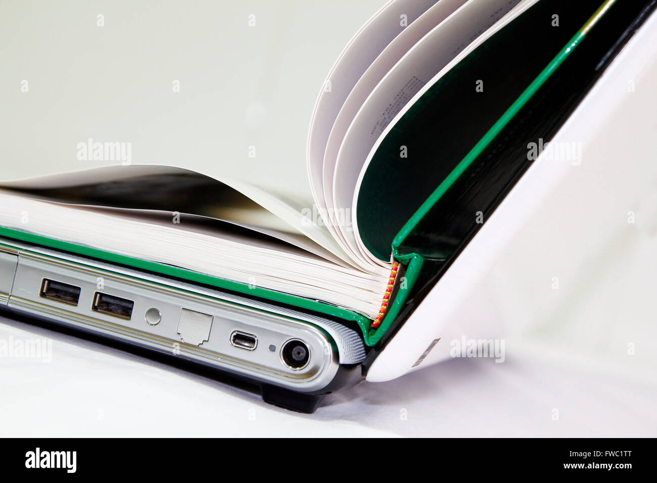 Open book over a computer Stock Photo - Alamy