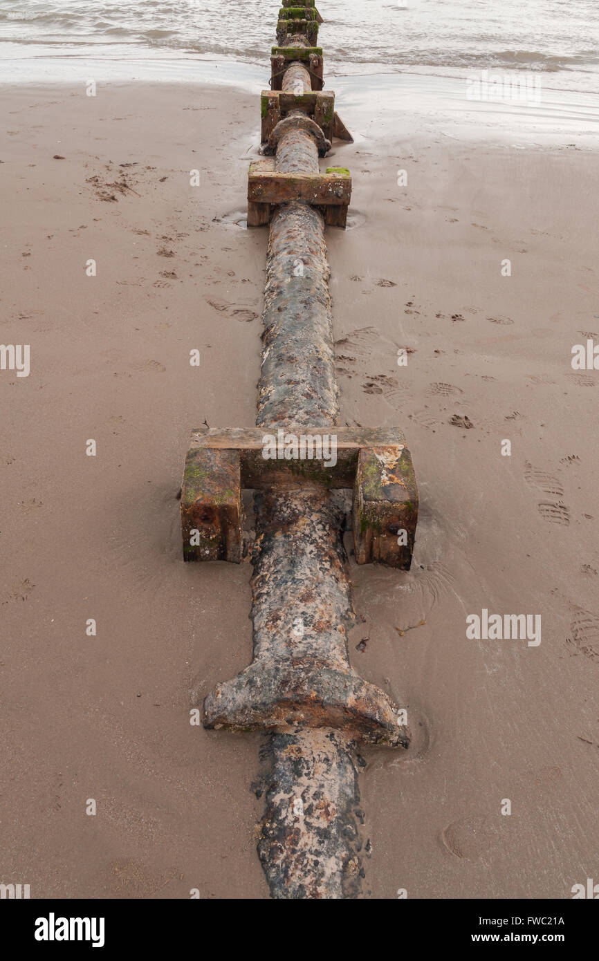 Sewage or waste water discharge pipe on Harlech beach in North Wales ...