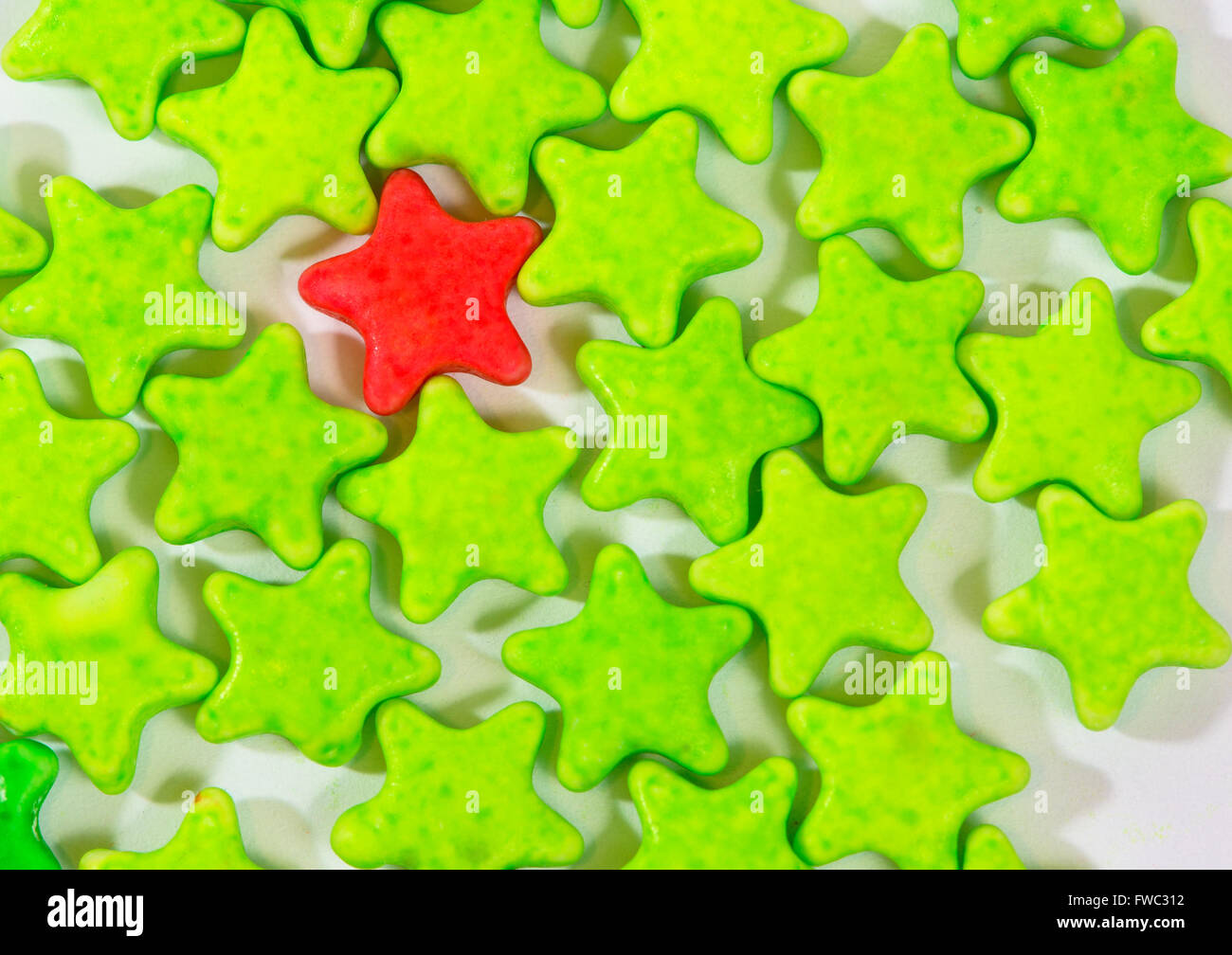 Red and green Star candies on white background Stock Photo - Alamy