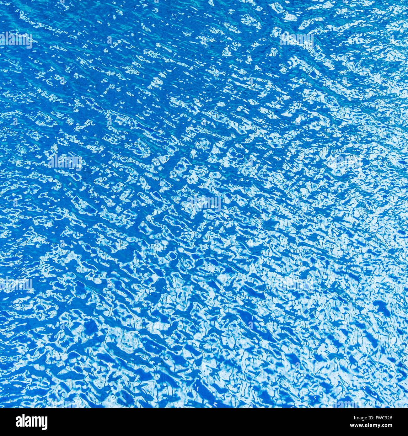 Swimming pool water surface with light reflections Stock Photo - Alamy