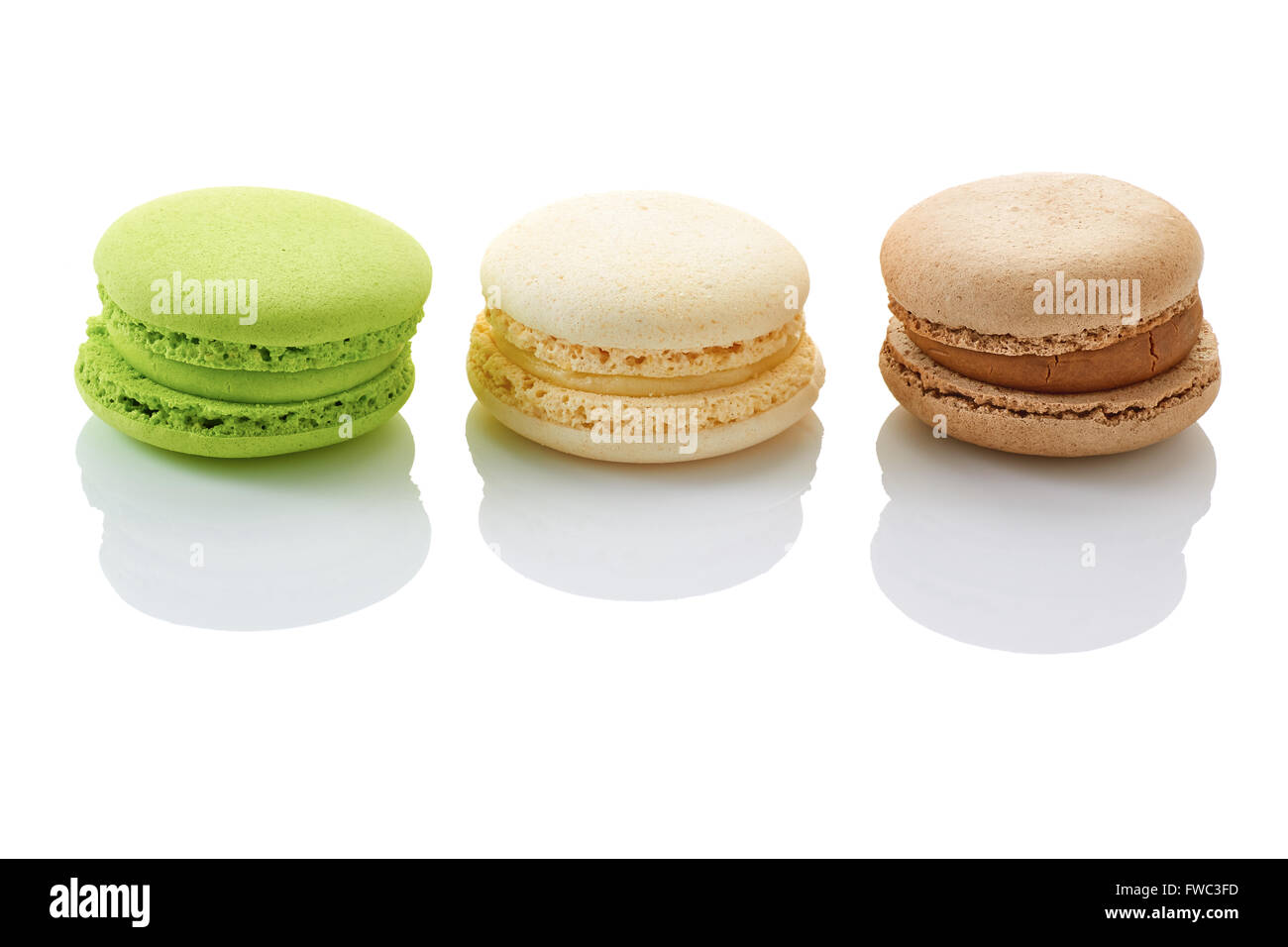 Three french macarons on white Stock Photo - Alamy