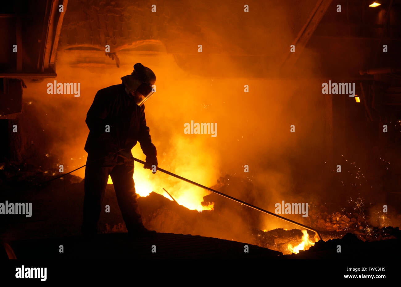 Team member taking iron samples using a lance on Blast Furnace No 5 at ...