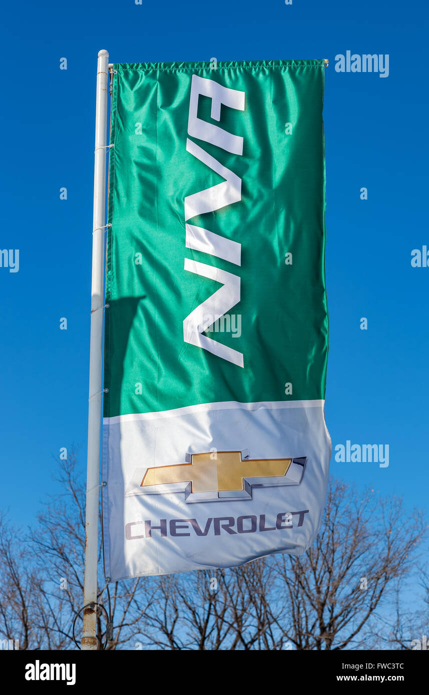Niva Chevrolet dealership sign against blue sky. Chevrolet is a ...