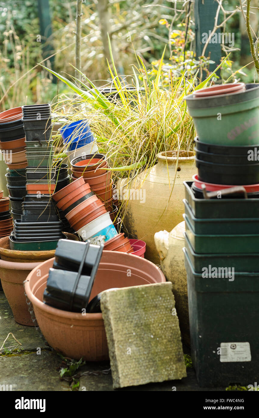 Stacks of plastic and terracotta pots outside in a garden Stock Photo ...