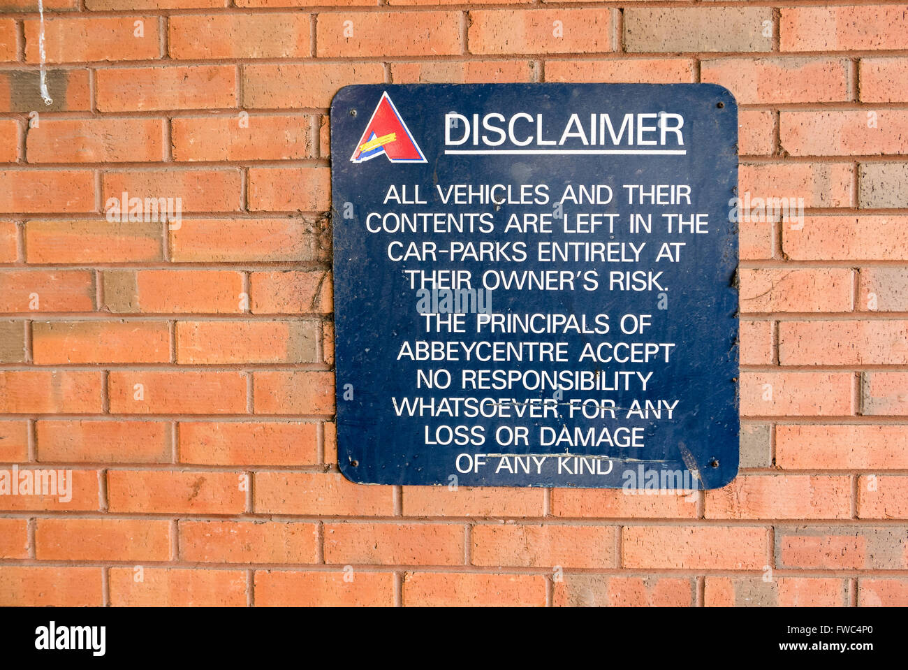 Disclaimer sign at a shopping centre car park, warning visitors that ...