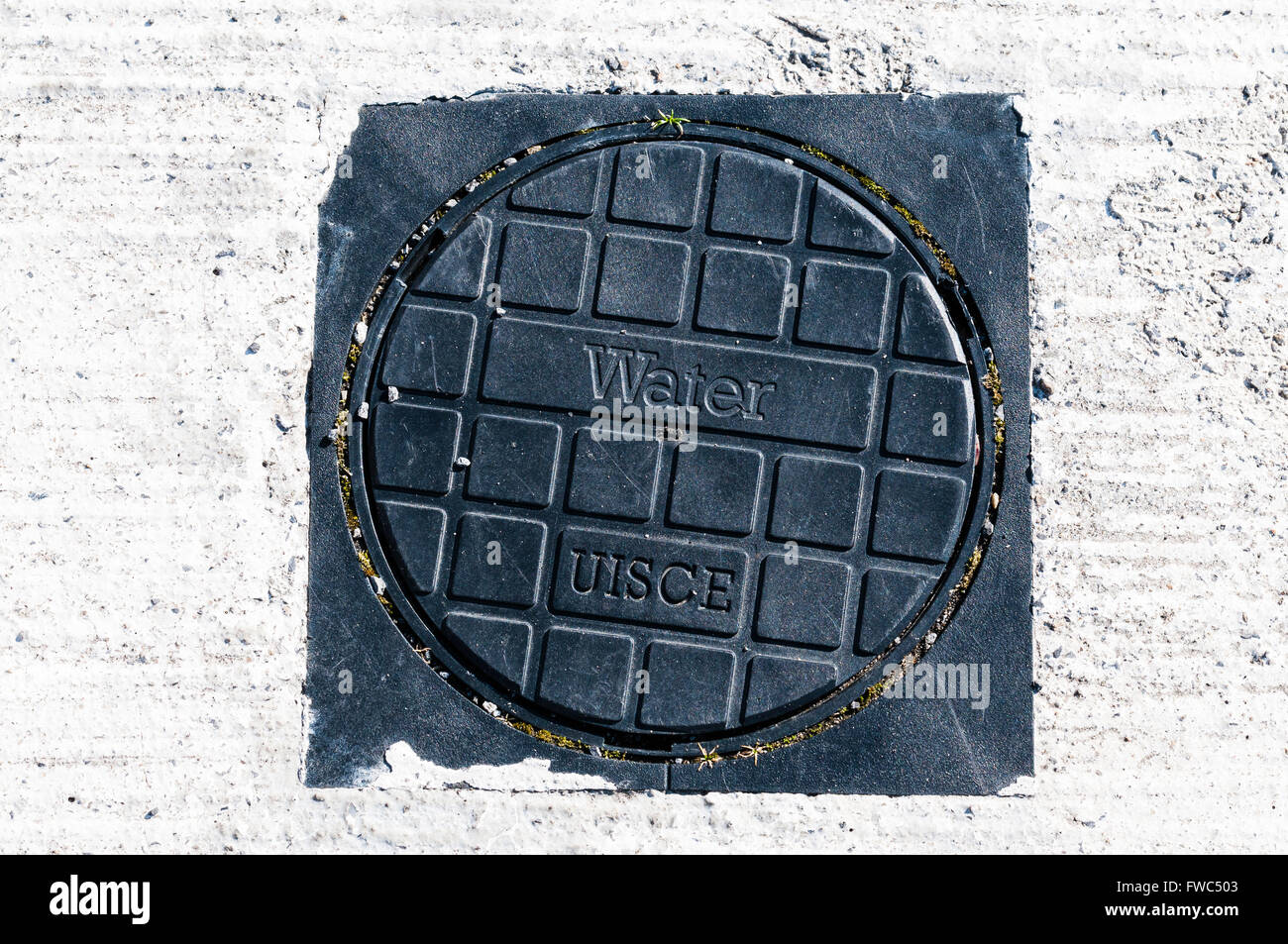 Water stopcock cover with Irish Gaelic word "Uisce" (Water) which ...