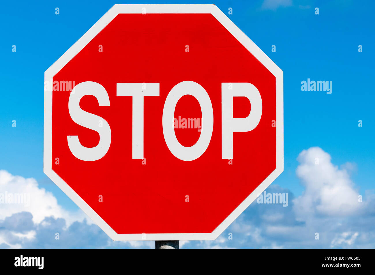 Stop sign against a blue sky Stock Photo - Alamy