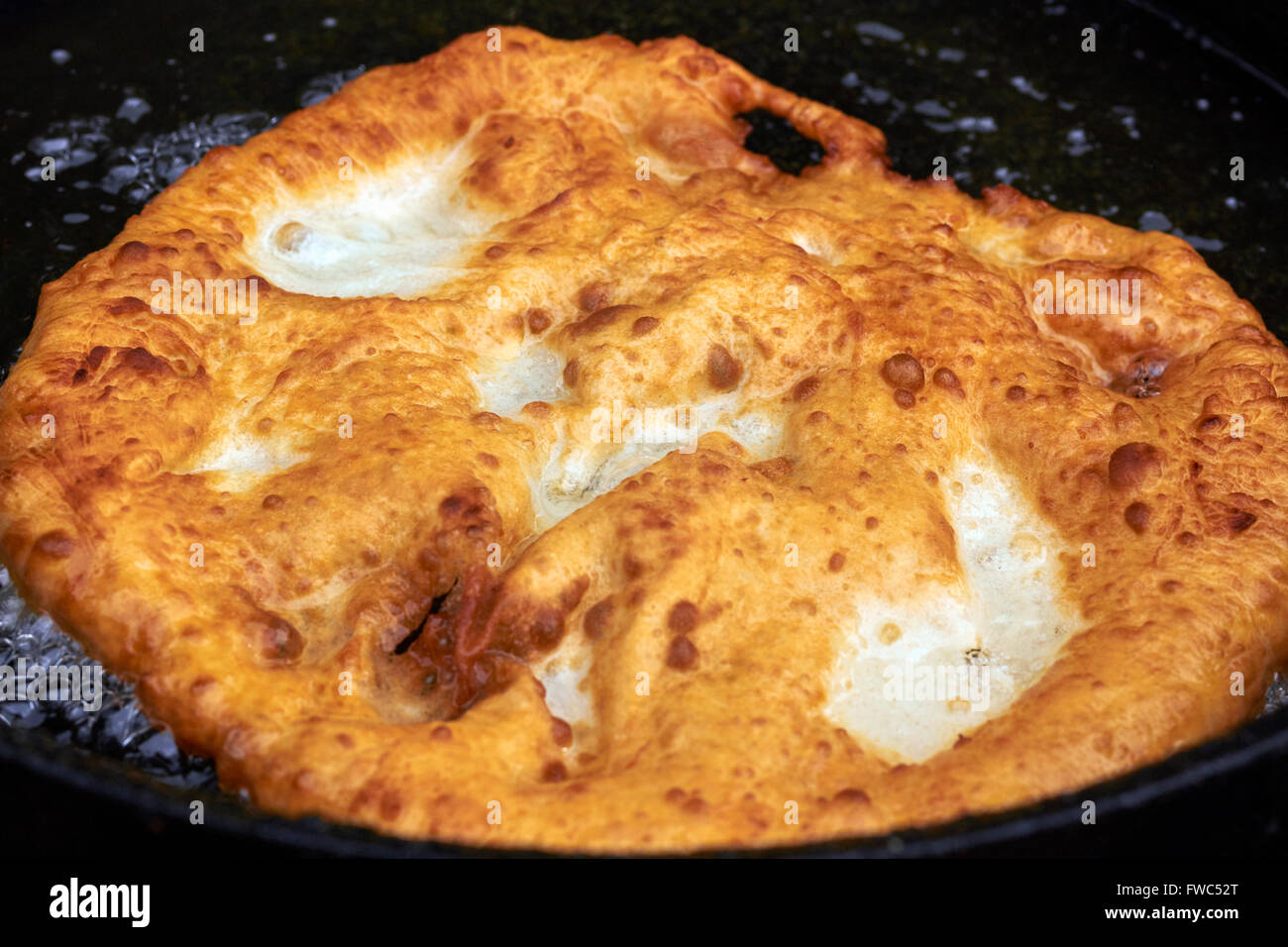 Frybread, a traditional food for Native Americans frying in oil at Page ...