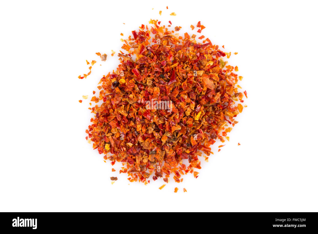 Crushed red chili pepper on white background Stock Photo - Alamy