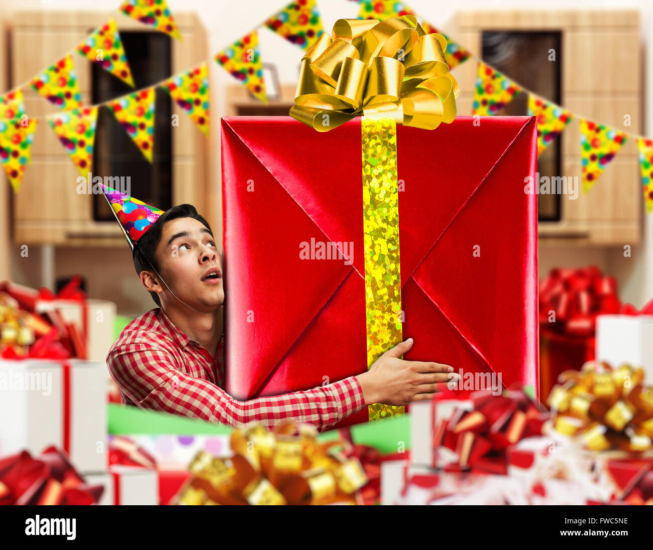 Man with a big gift Stock Photo - Alamy