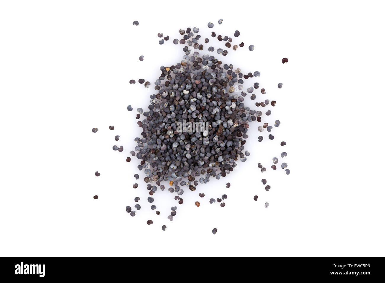 Poppy seeds heap close up isolated on white background Stock Photo - Alamy