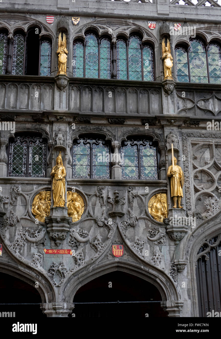 Guilded stone statues at the Basilica of the Holy Blood in Bruges ...