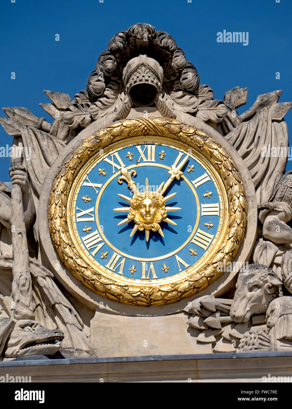 Statues of Hercules and Mars flank he clock overlooking the courtyard ...