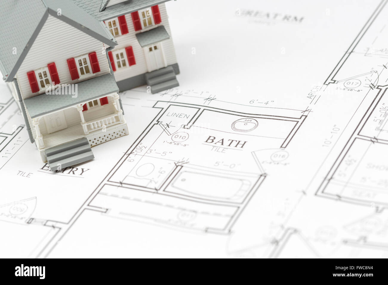 Model House Resting on Custom House Plans Stock Photo - Alamy