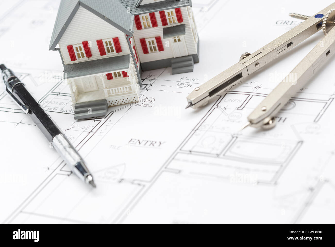 Model Home, Pencil and Compass Resting On Custom House Plans Stock ...