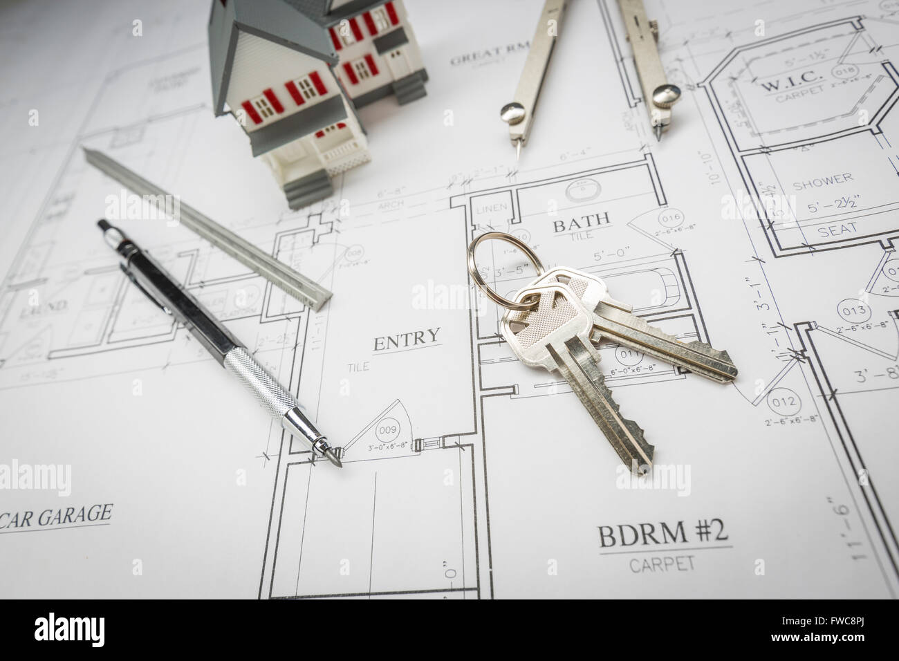 Model Home, Pencil, Compass, Ruler and Keys Resting On Custom House ...