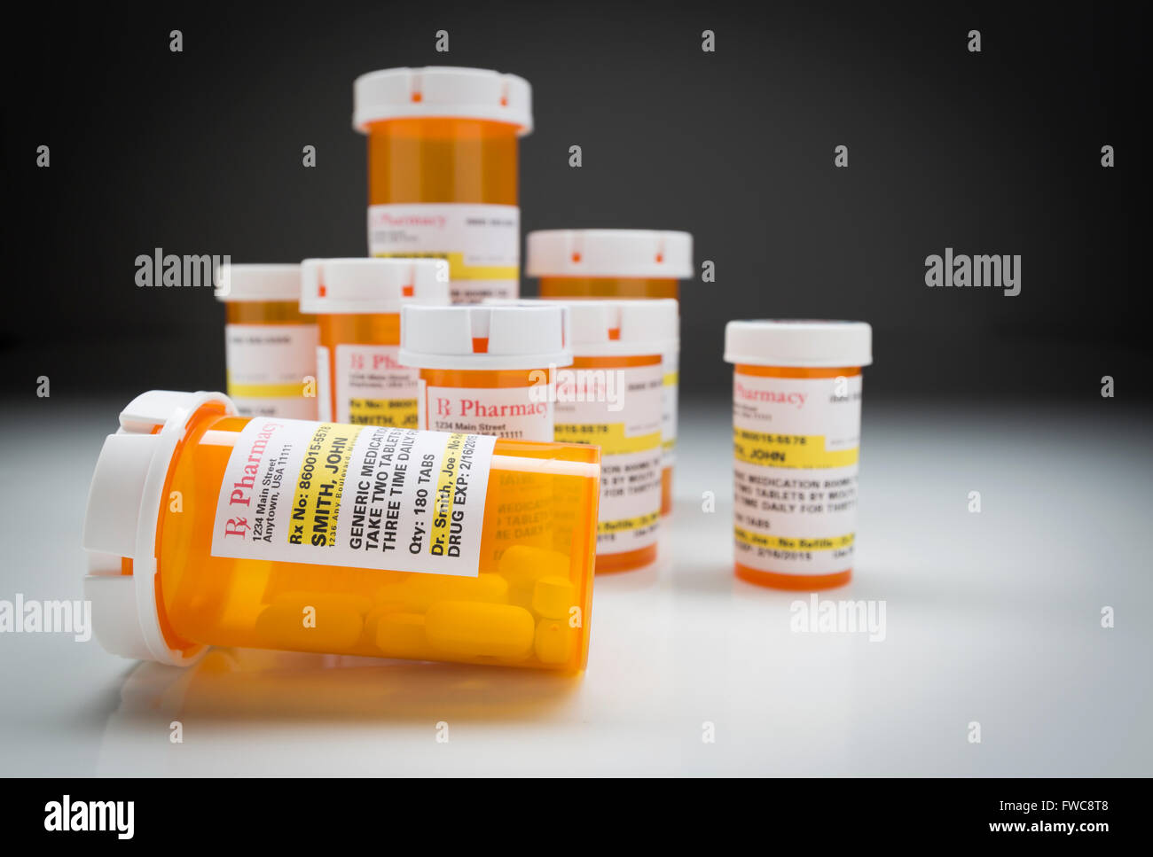 Variety of Non-Proprietary Medicine Bottles on Reflective Surface and ...