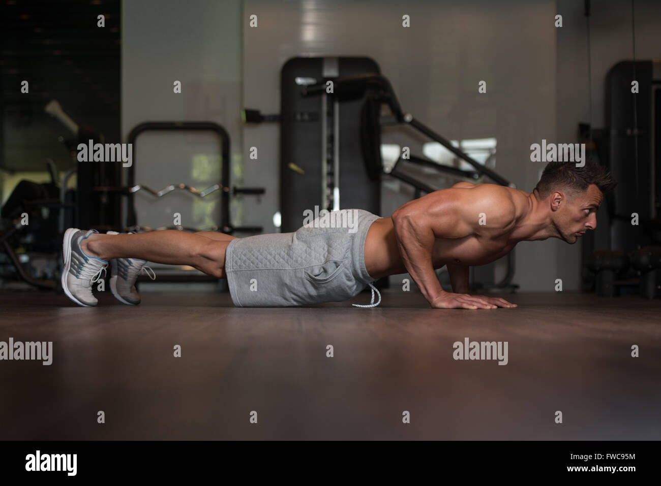 Young Man Athlete Doing Pushups As Part Of Bodybuilding Training Stock ...
