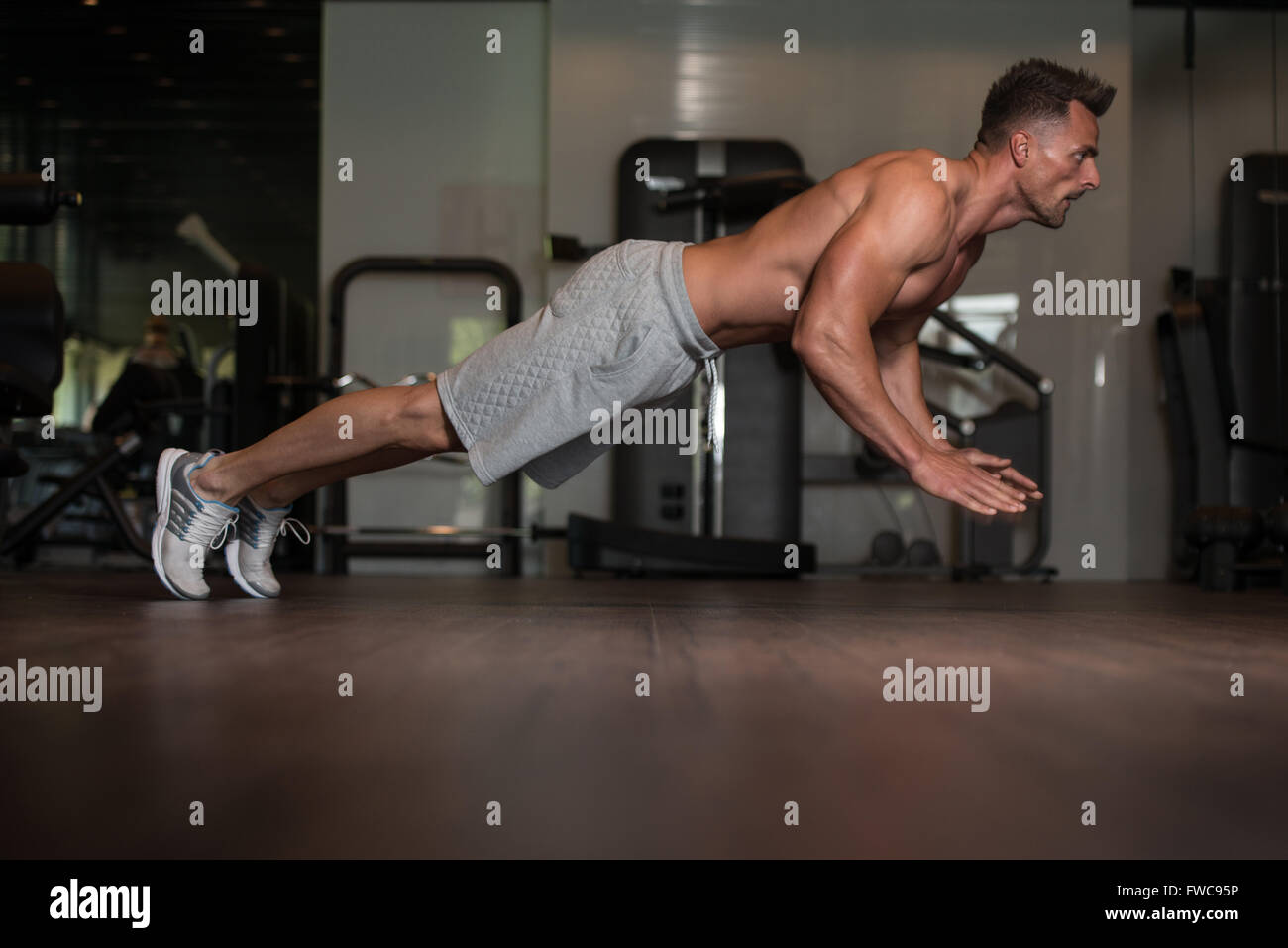 Young Man Athlete Doing Extreme Pushups As Part Of Bodybuilding Training Stock Photo - Alamy