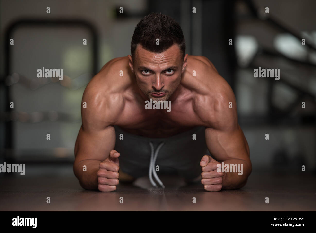 Young Man Athlete Doing Pushups As Part Of Bodybuilding Training Stock ...