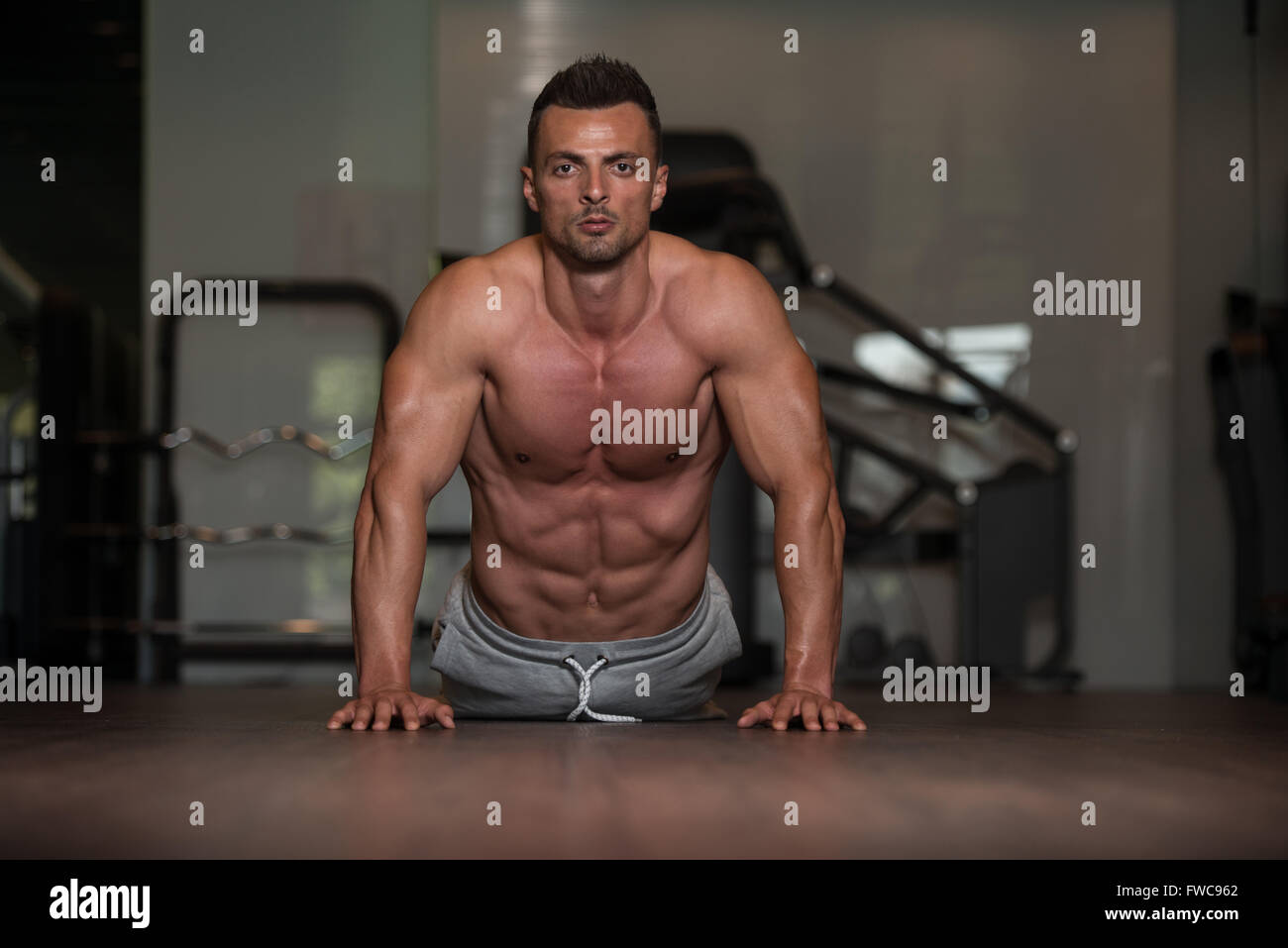 Young Man Athlete Doing Pushups As Part Of Bodybuilding Training Stock ...