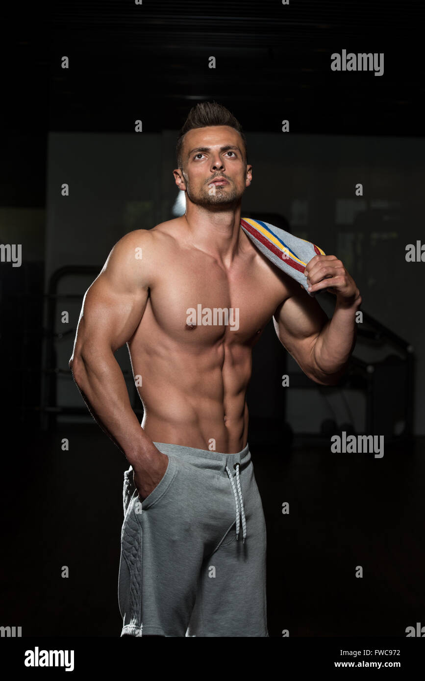 Physically fit man flexing triceps hi-res stock photography and images ...