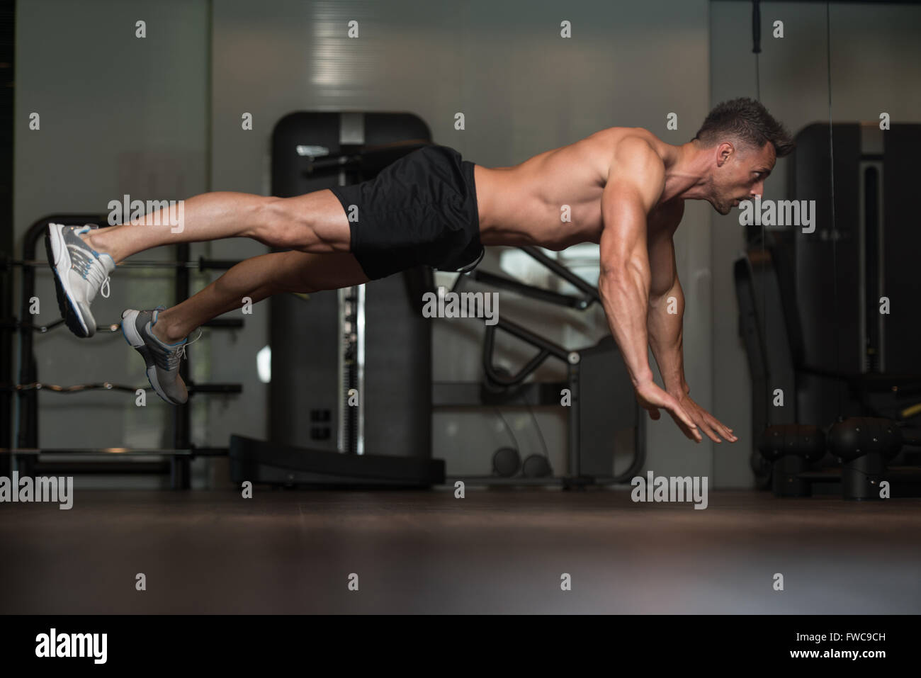 Young Man Athlete Doing Extreme Pushups As Part Of Bodybuilding ...