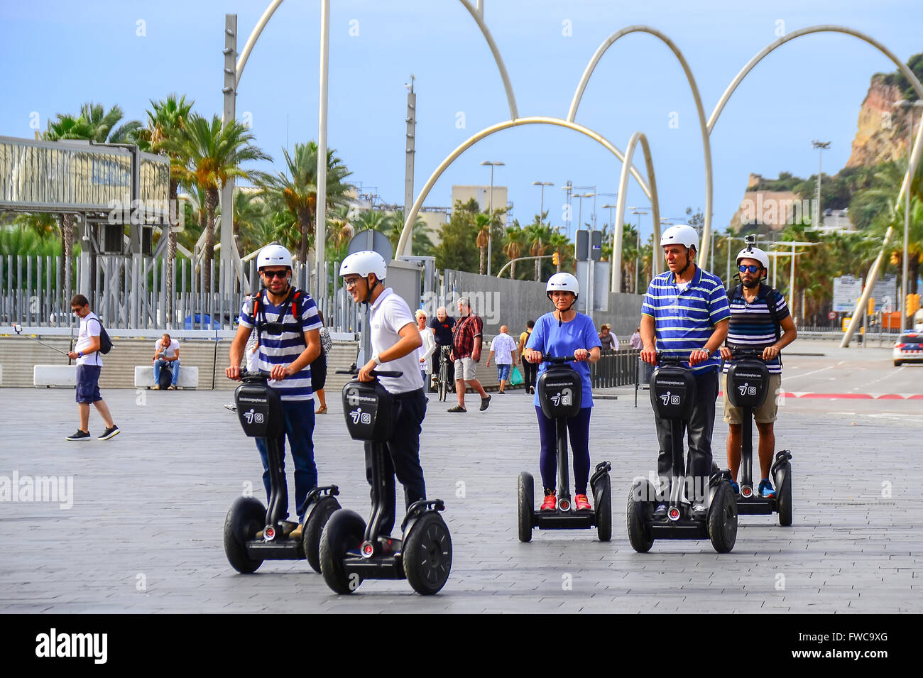 Tourist sightseeing on Segway tour of Barcelona in the seafront Stock ...
