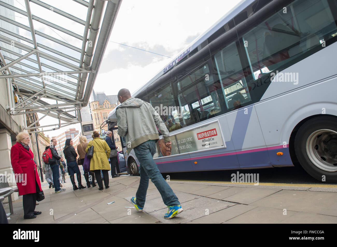 Passenger paying the fare on a First bus in Sheffield South Yorkshire ...