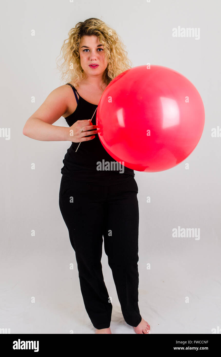 Blowing balloons female hi-res stock photography and images - Alamy