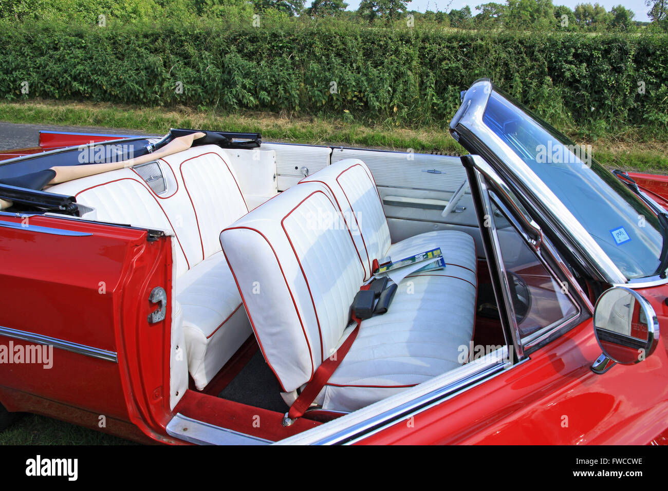 Red Oldsmobile convertible American classic car with white cream ...