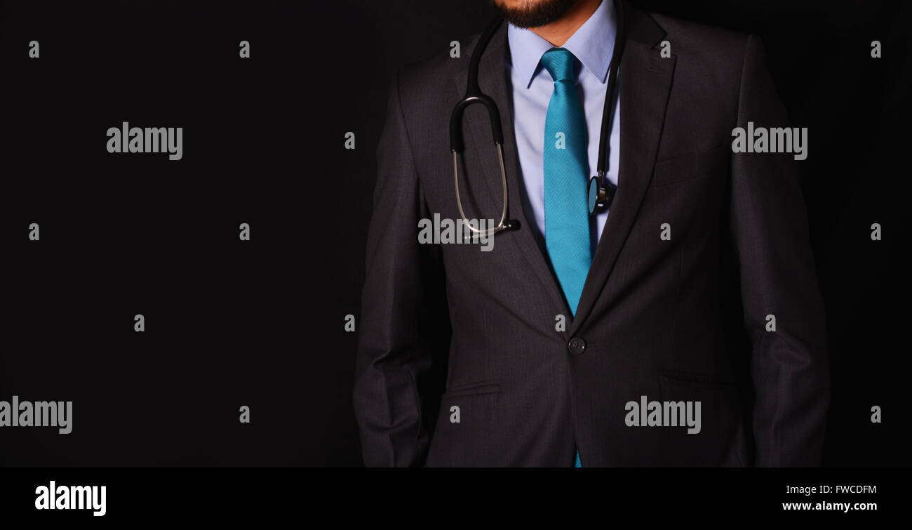 Doctor with stethoscope around neck black background Stock Photo - Alamy