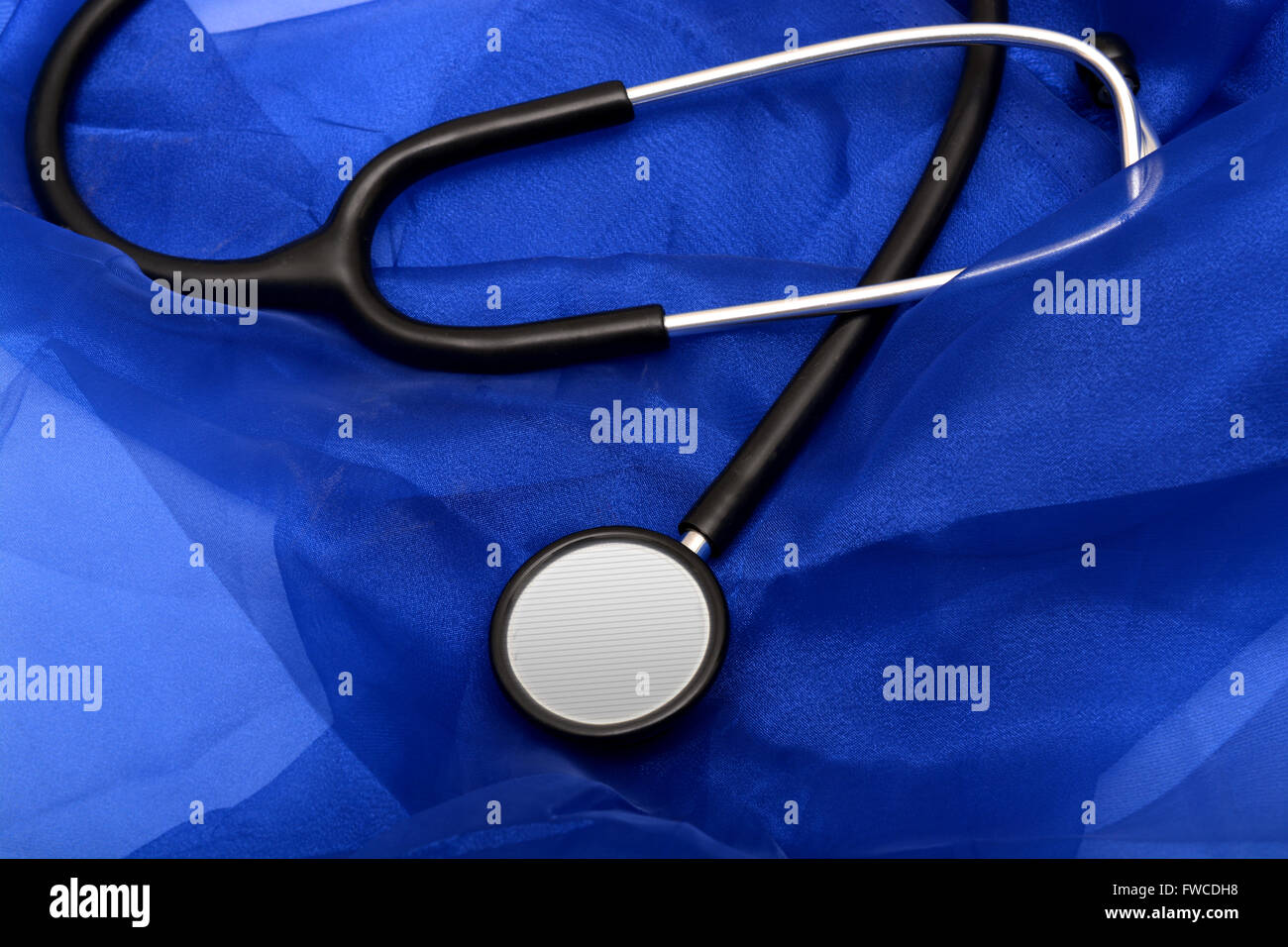Black stethoscope on blue hi-res stock photography and images - Alamy