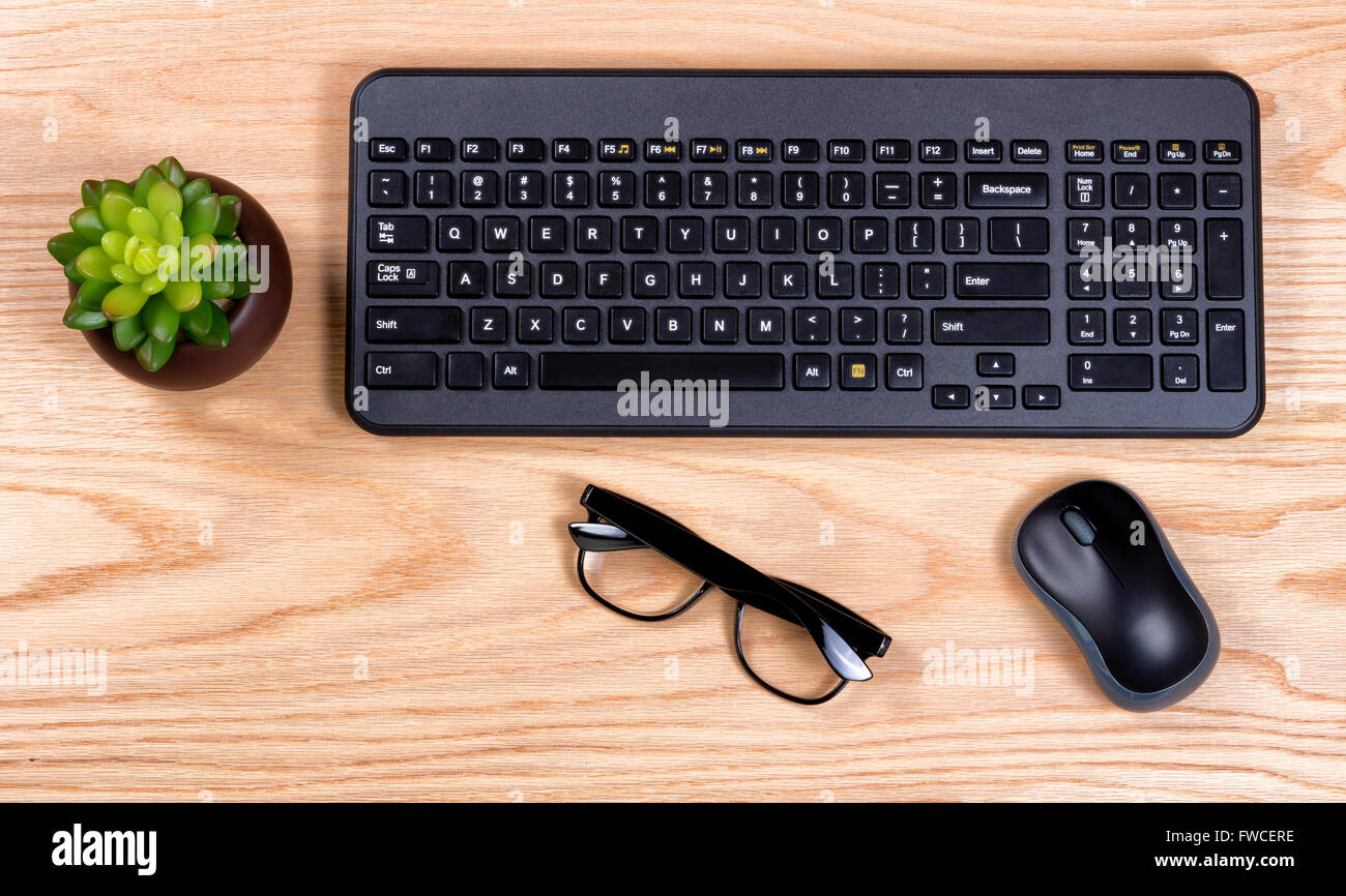 Overhead view of a clean desk consisting of computer keyboard, baby ...