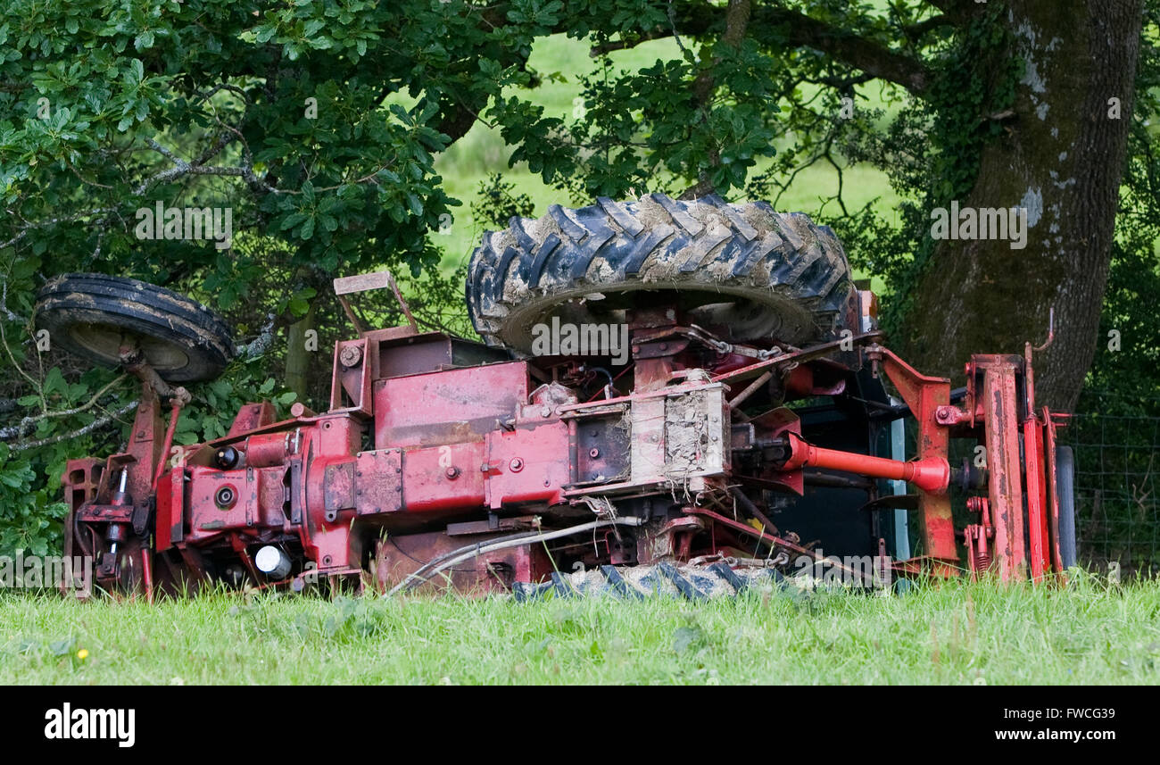 Tractor overturned, red black green background Stock Photo - Alamy