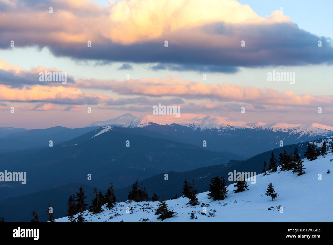 Fantastic evening winter landscape. Dramatic overcast sky Stock Photo ...