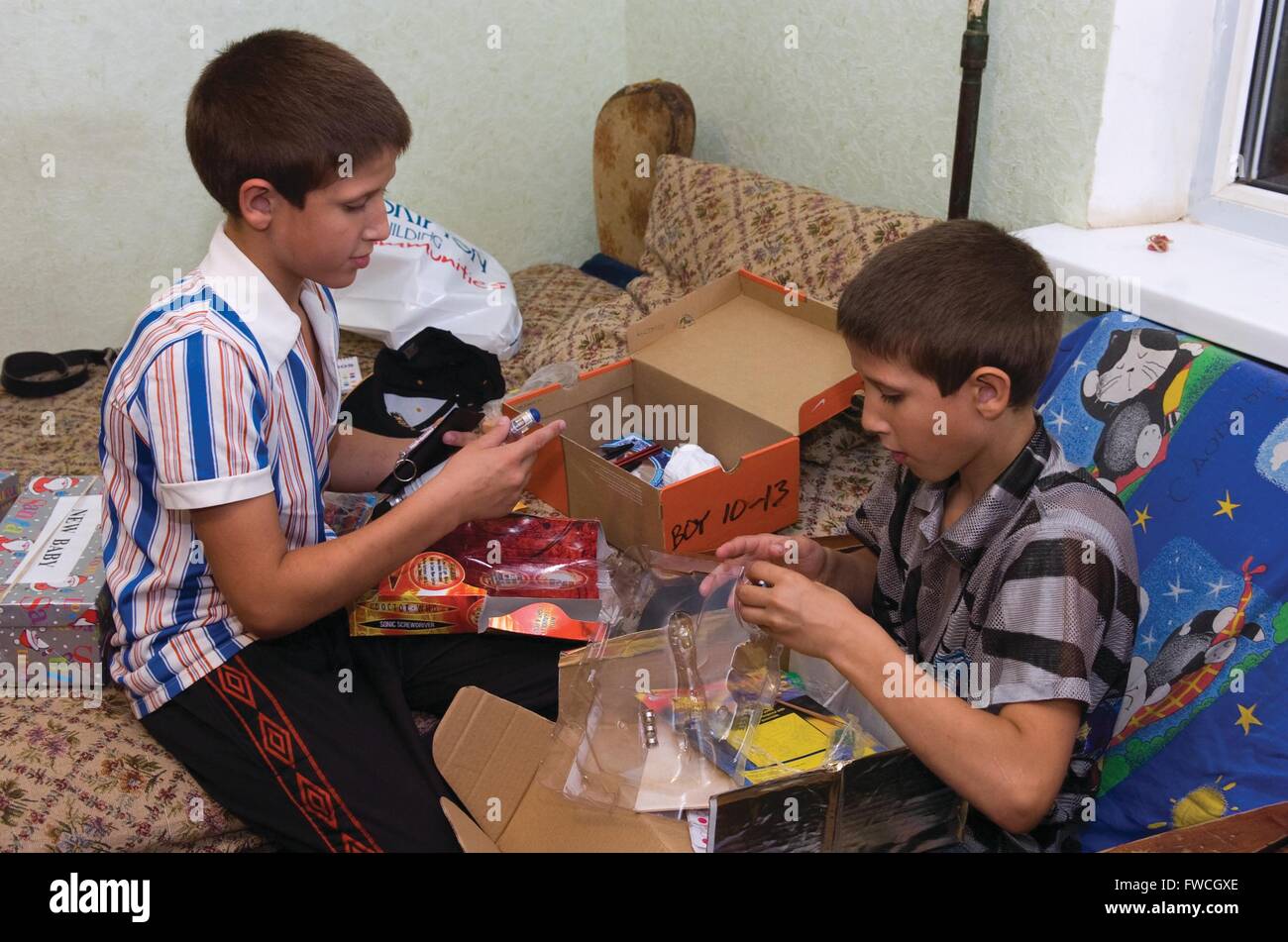 Poor families in the former Soviet Union accept charity donations from ...