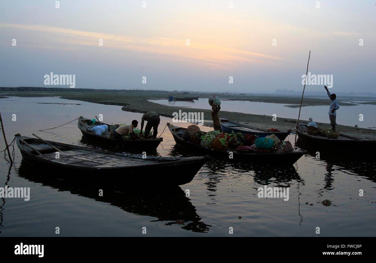 Allahabad, India. 03rd Apr, 2016. Farmers transport cucumber via boats ...