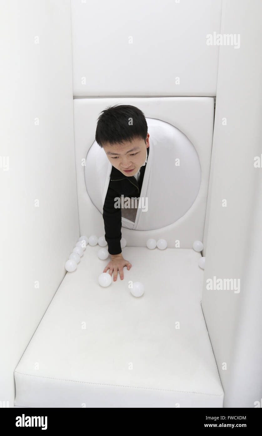 Shanghai, China. 4th Apr, 2016. A person experiences "birth" from a ...